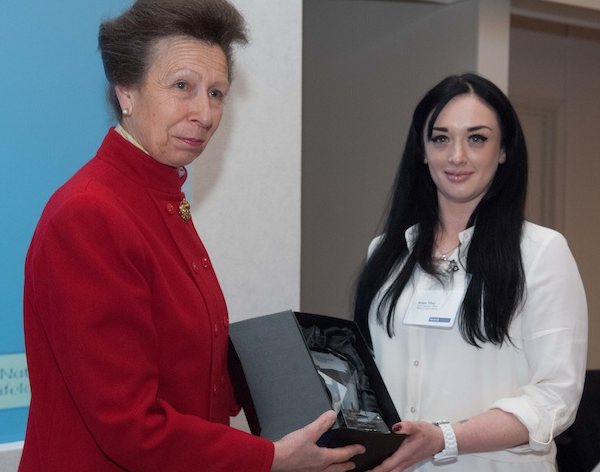 Master's student who grew up in care receives Royal honour